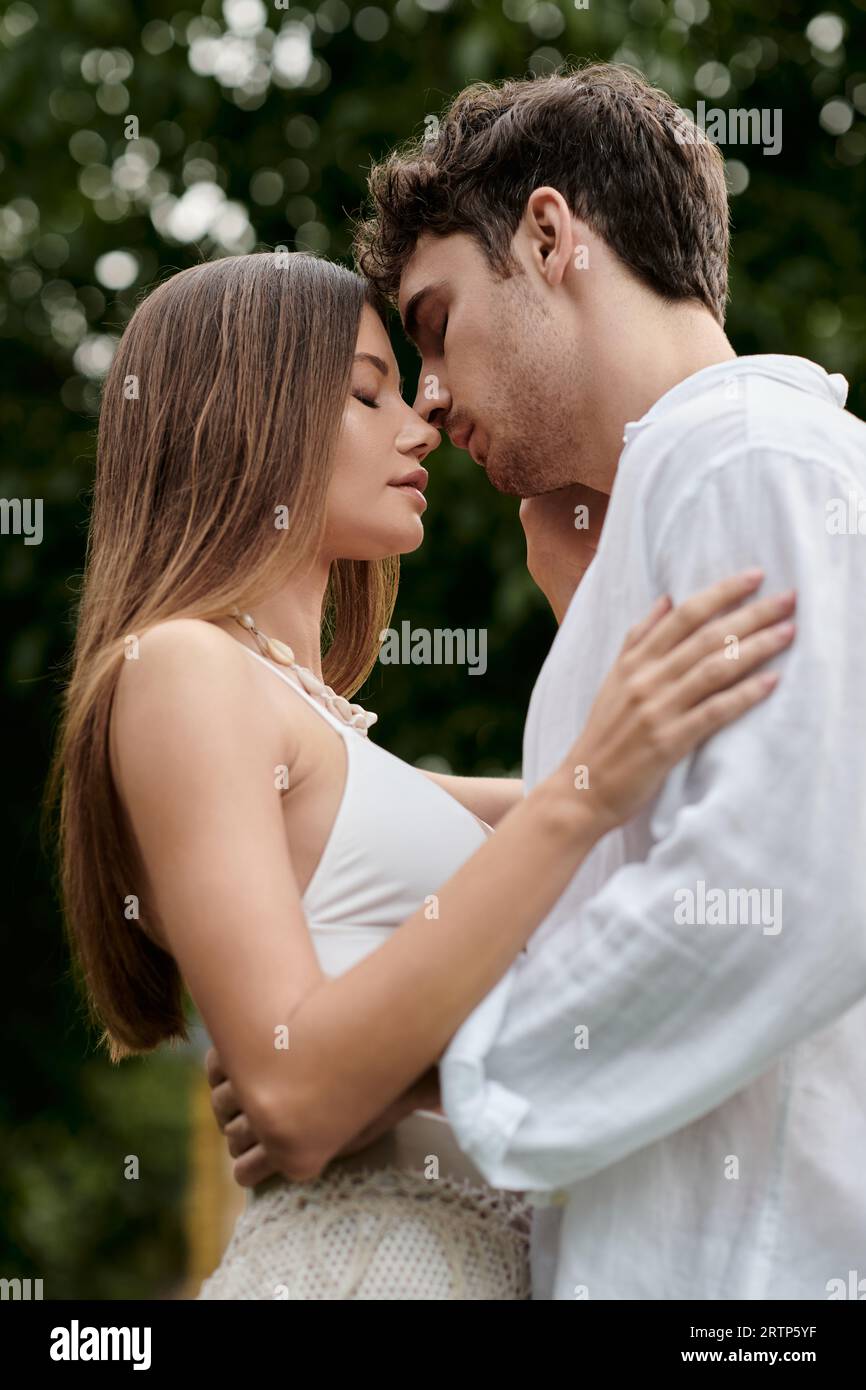 Side View Of Handsome Man Kissing Girlfriend In Crop Top And Standing 3494