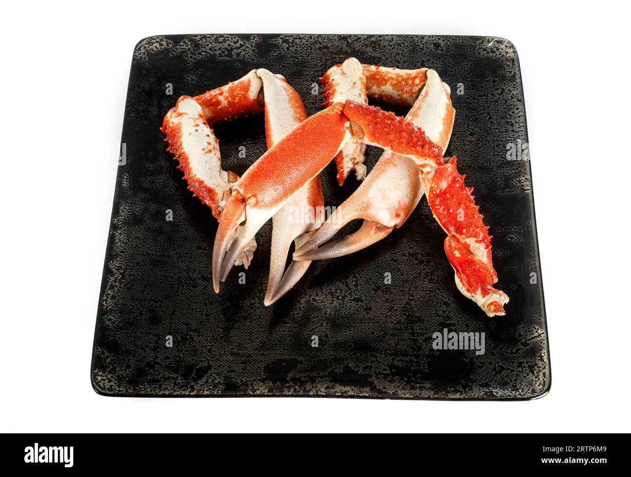 king crab leg in front of white background Stock Photo - Alamy