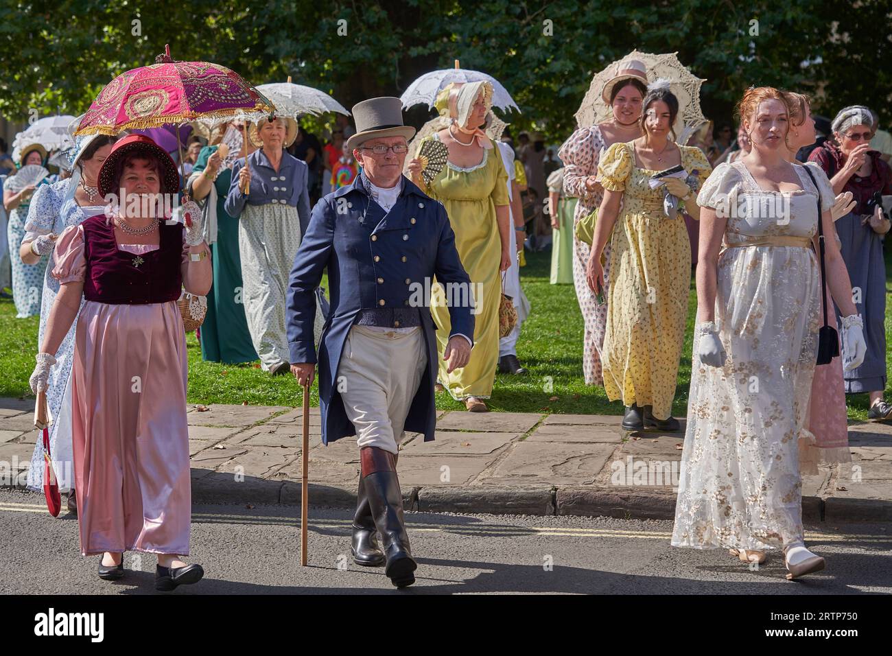 Parade of people dressed in period costume from the Georgian era as ...