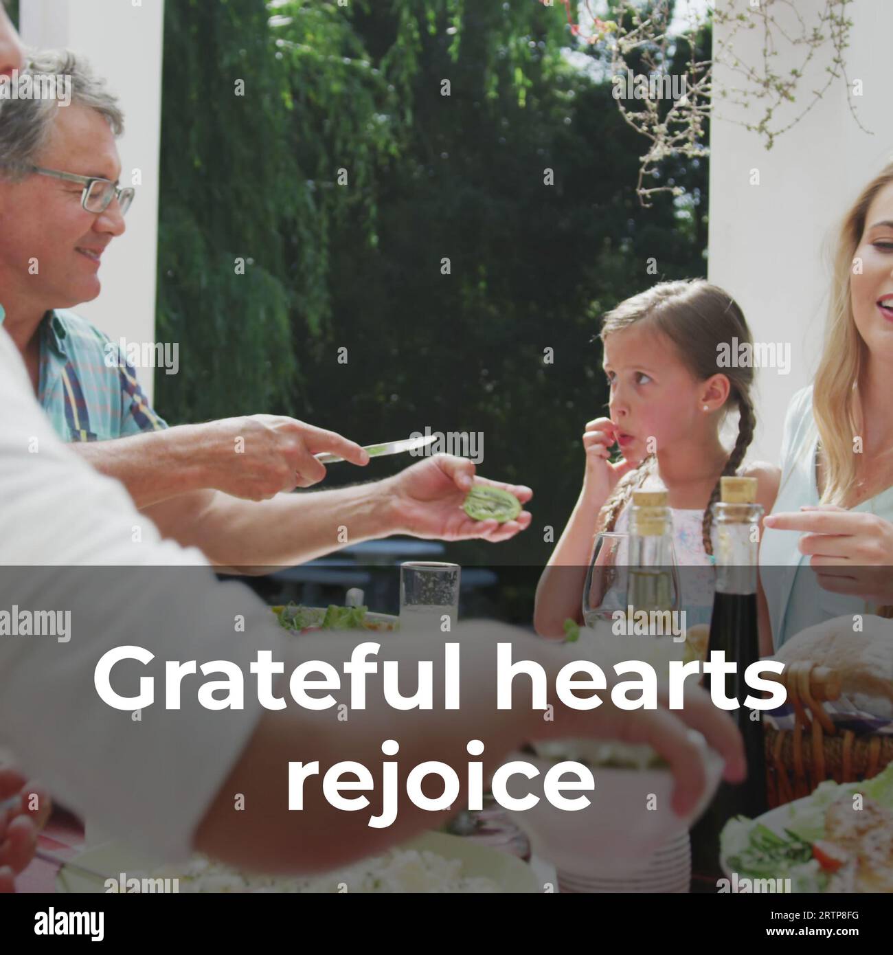 Grateful hearts rejoice text over caucasian family eating thanksgiving ...