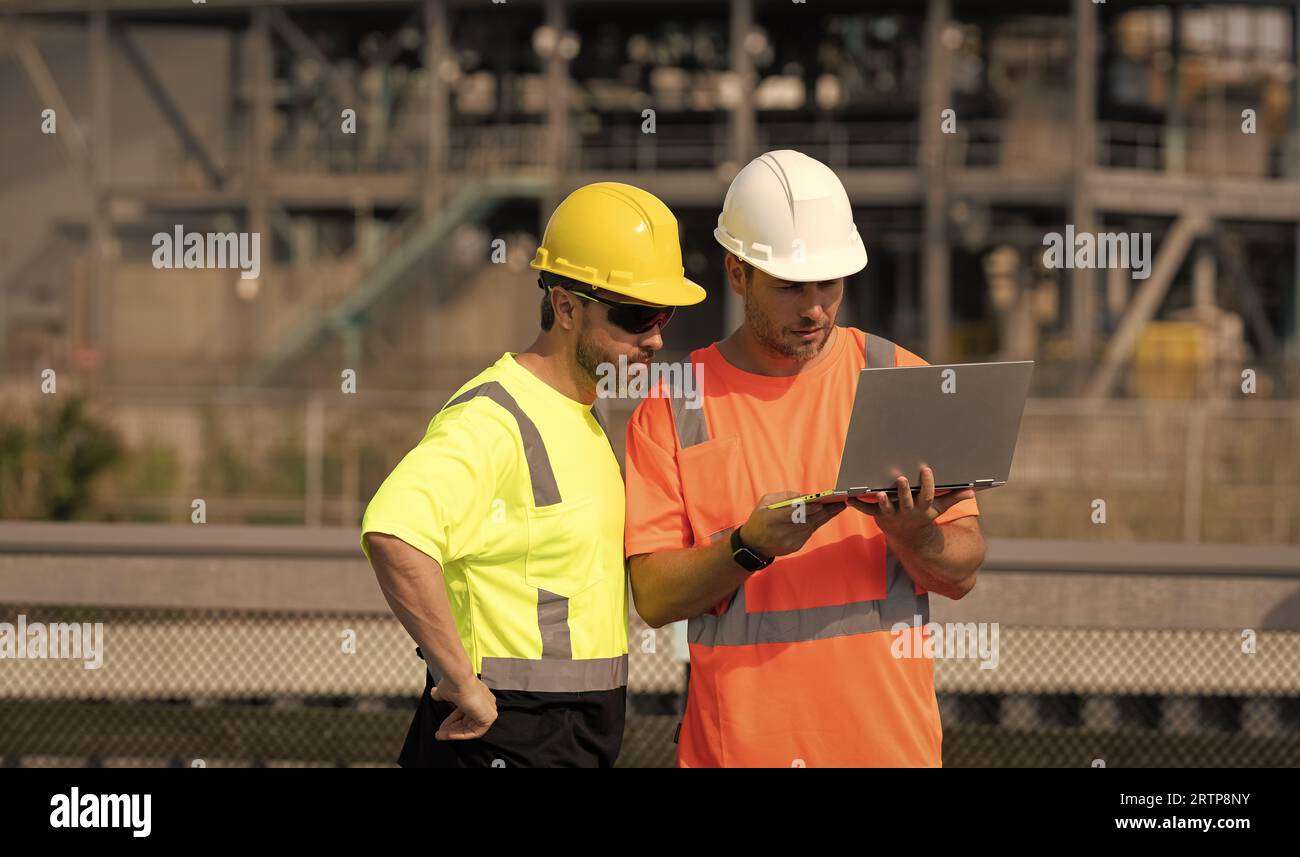 concentrated supervisor men have construction project on laptop. photo ...