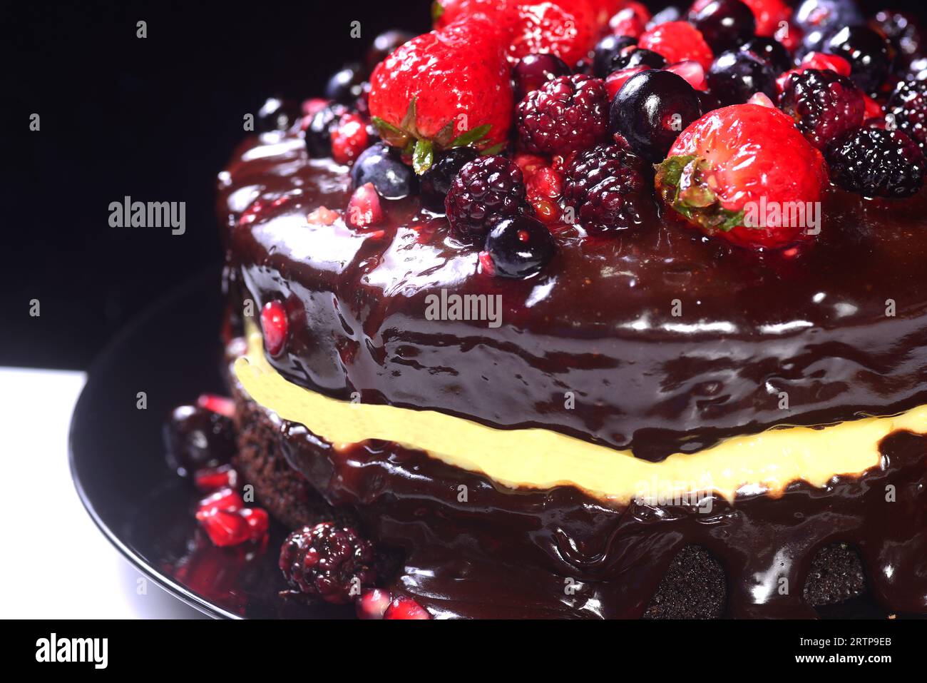 Chocolate cake with an Amaretto pastry cream topped with glazed fruit ...