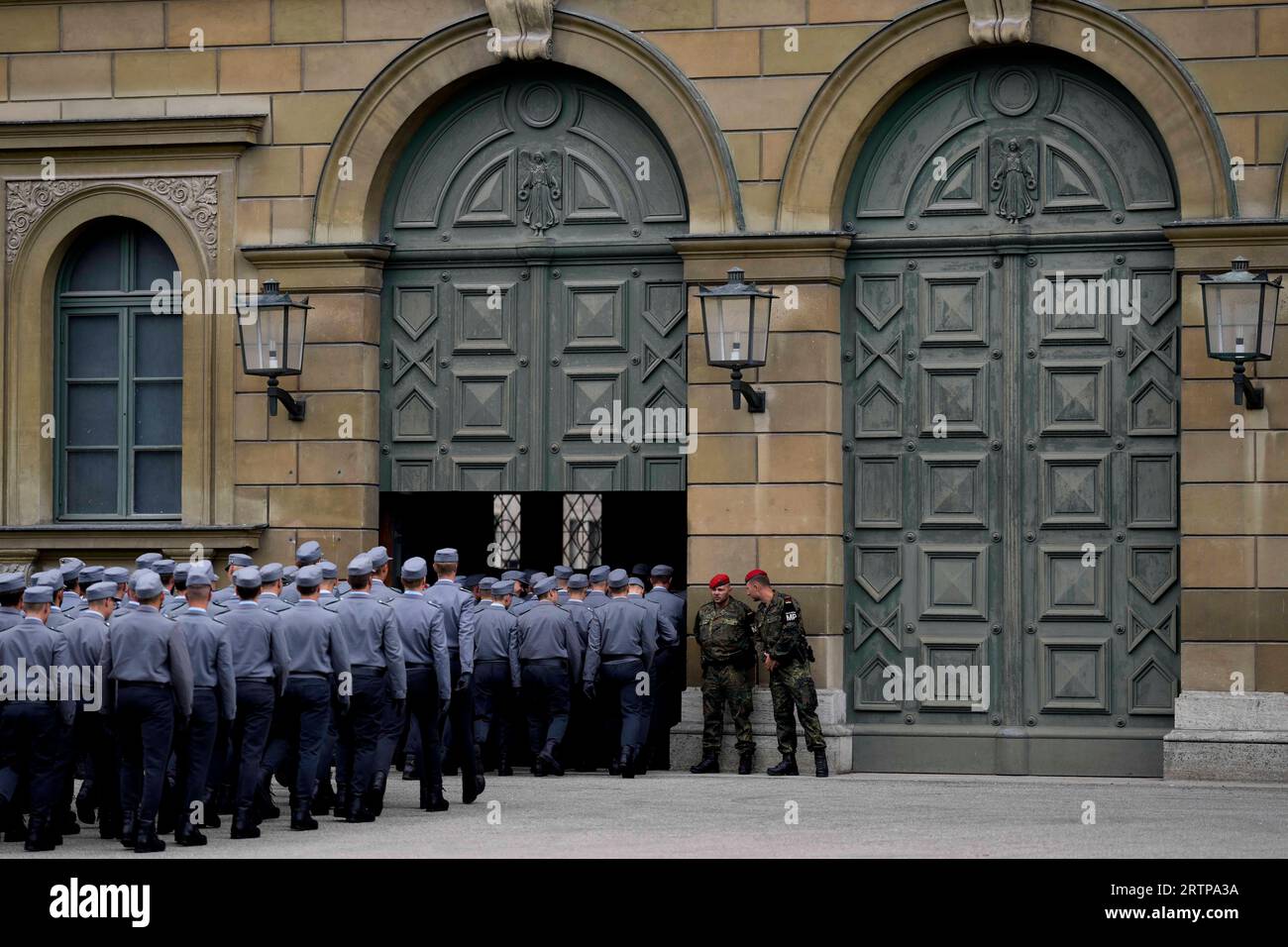 Military police officers talk to each other as 'Gebirgsjaeger' mountain ...