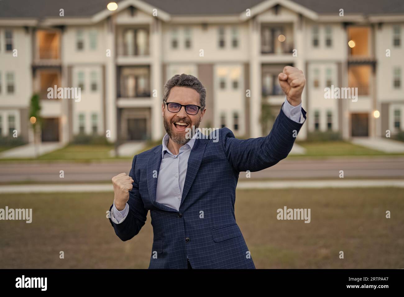 glad salesman at the house. salesman in the suit. salesman outdoor ...