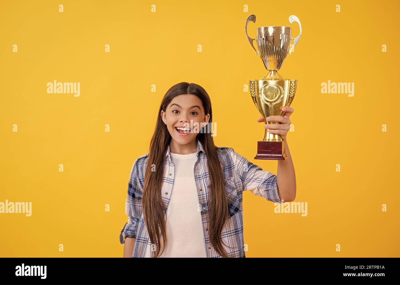 amazed teen girl receive award in studio. teen girl accept award on ...