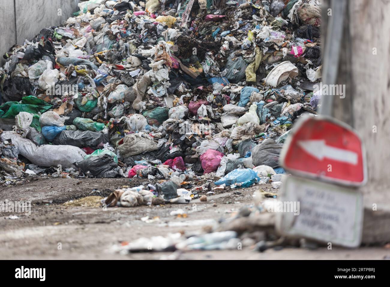 Landfill site, a pile of stinky different junk disposal in the concrete ...