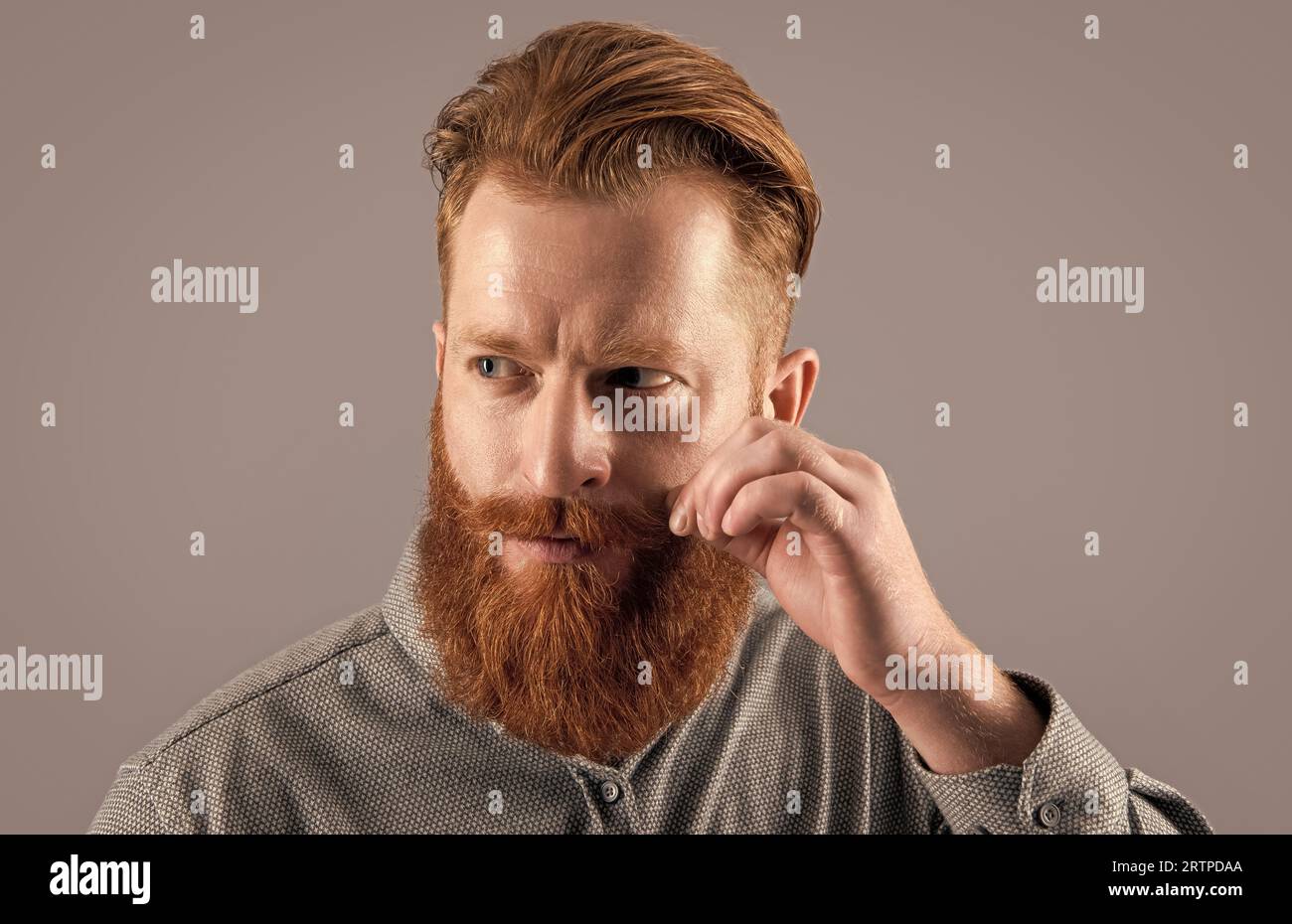 Portrait of Irish man twirling mustache. Bearded man with unshaven face ...