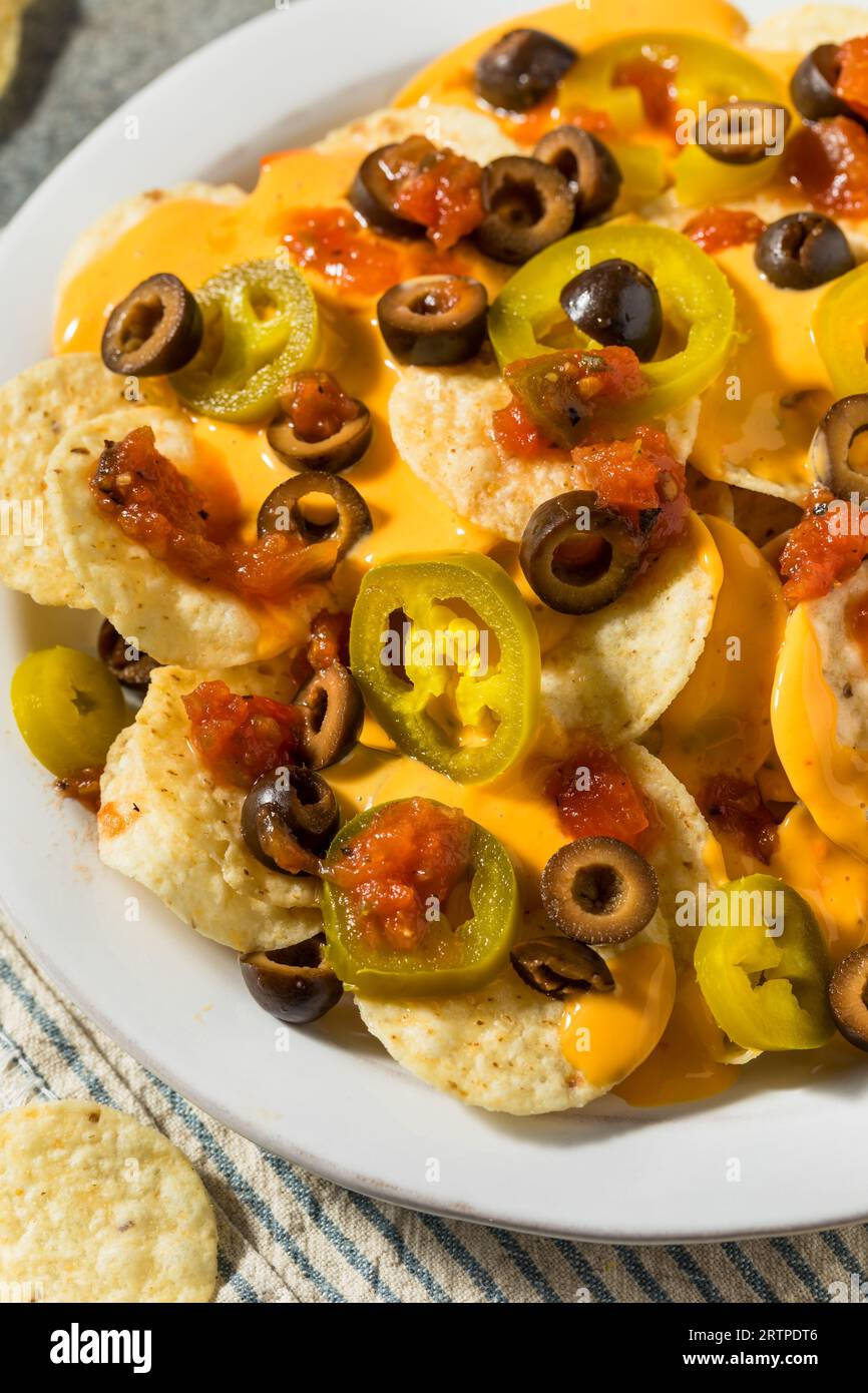 Homemade Basic Mexican Nachos with Cheese Jalapeno and Olives Stock ...