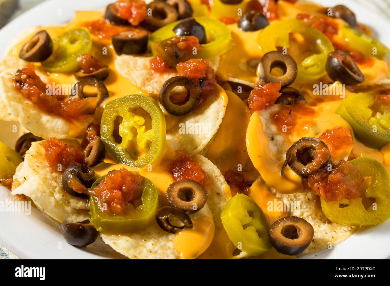 Homemade Basic Mexican Nachos with Cheese Jalapeno and Olives Stock ...