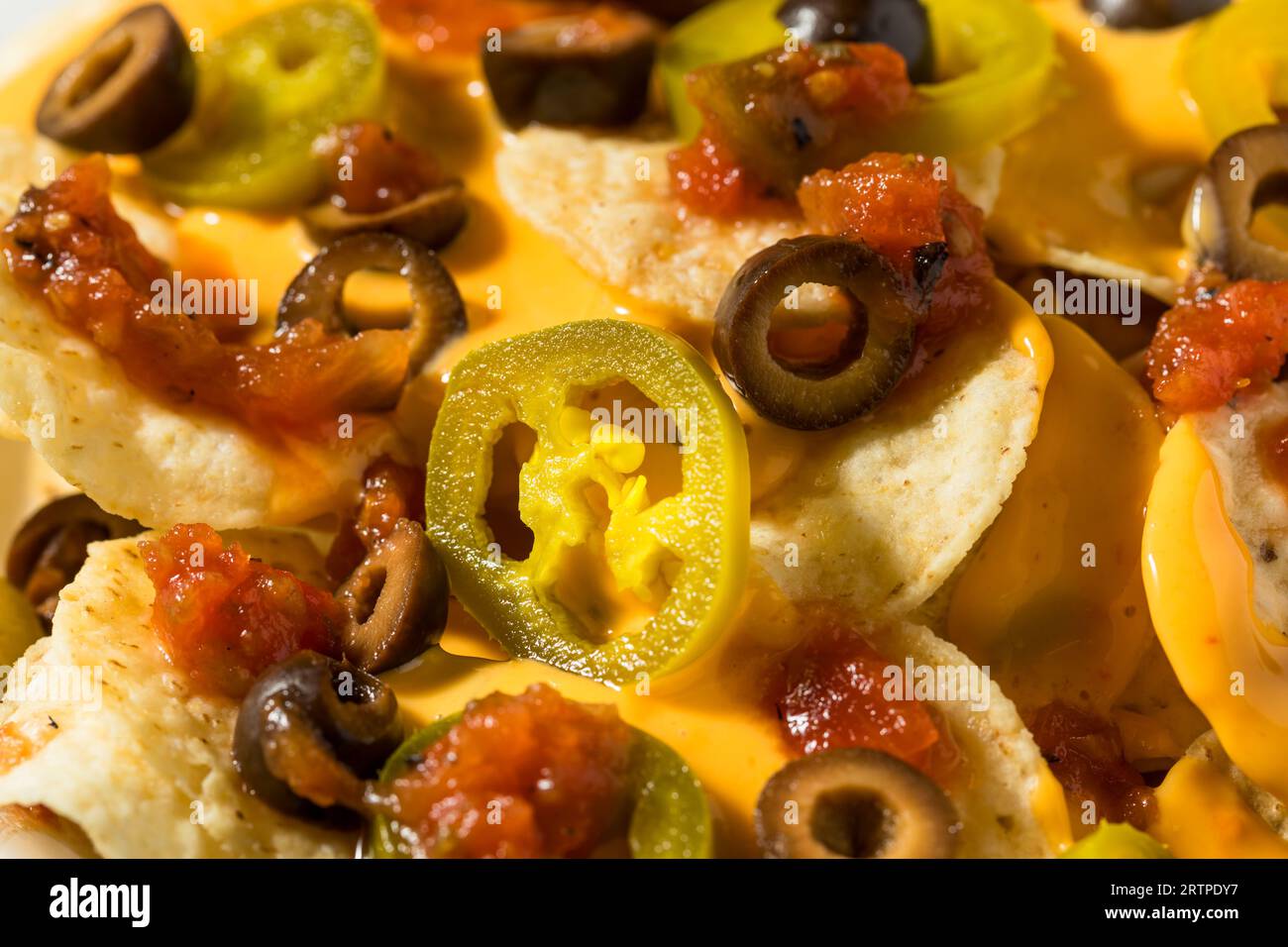 Homemade Basic Mexican Nachos with Cheese Jalapeno and Olives Stock ...