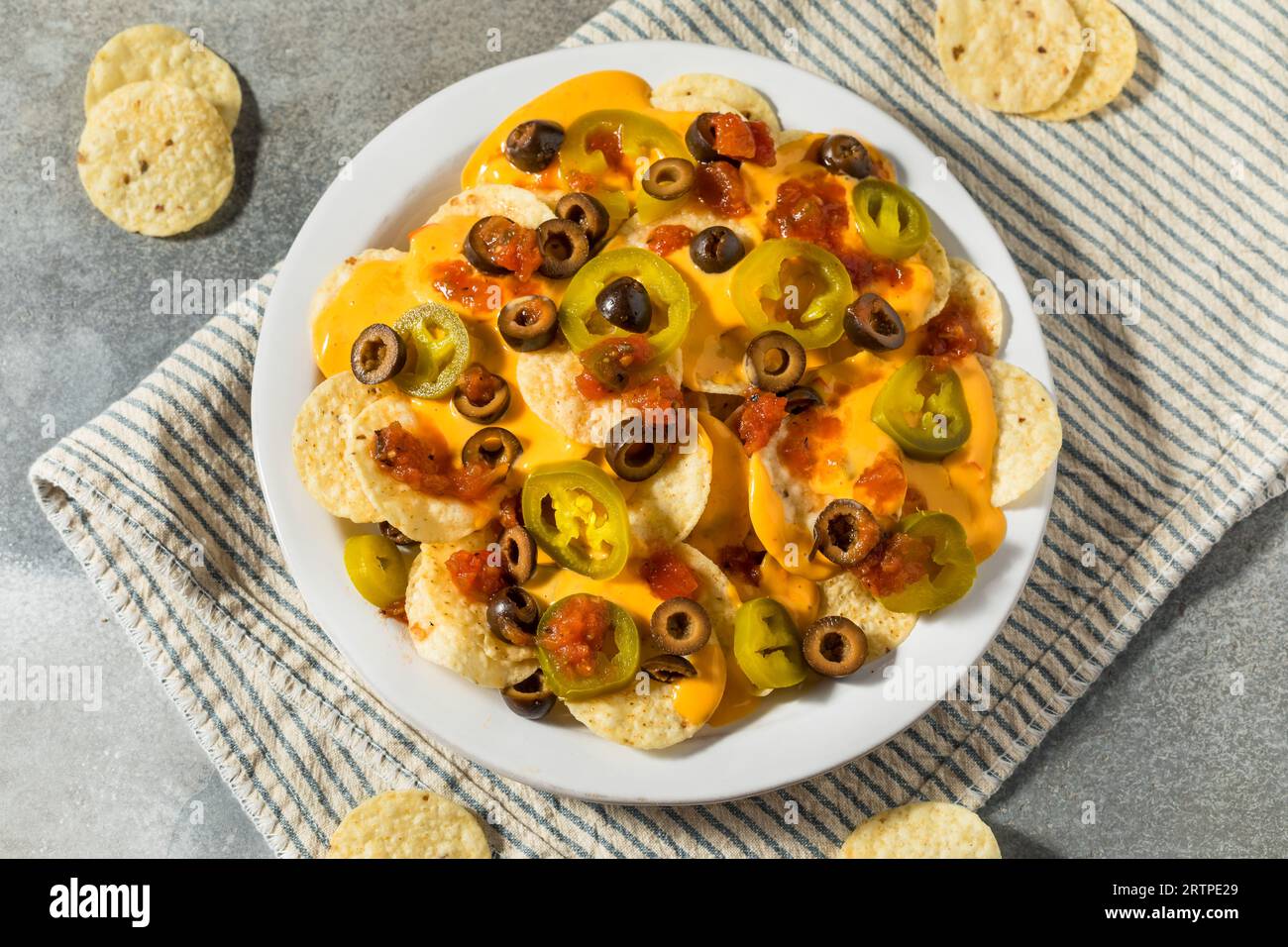 Homemade Basic Mexican Nachos with Cheese Jalapeno and Olives Stock ...