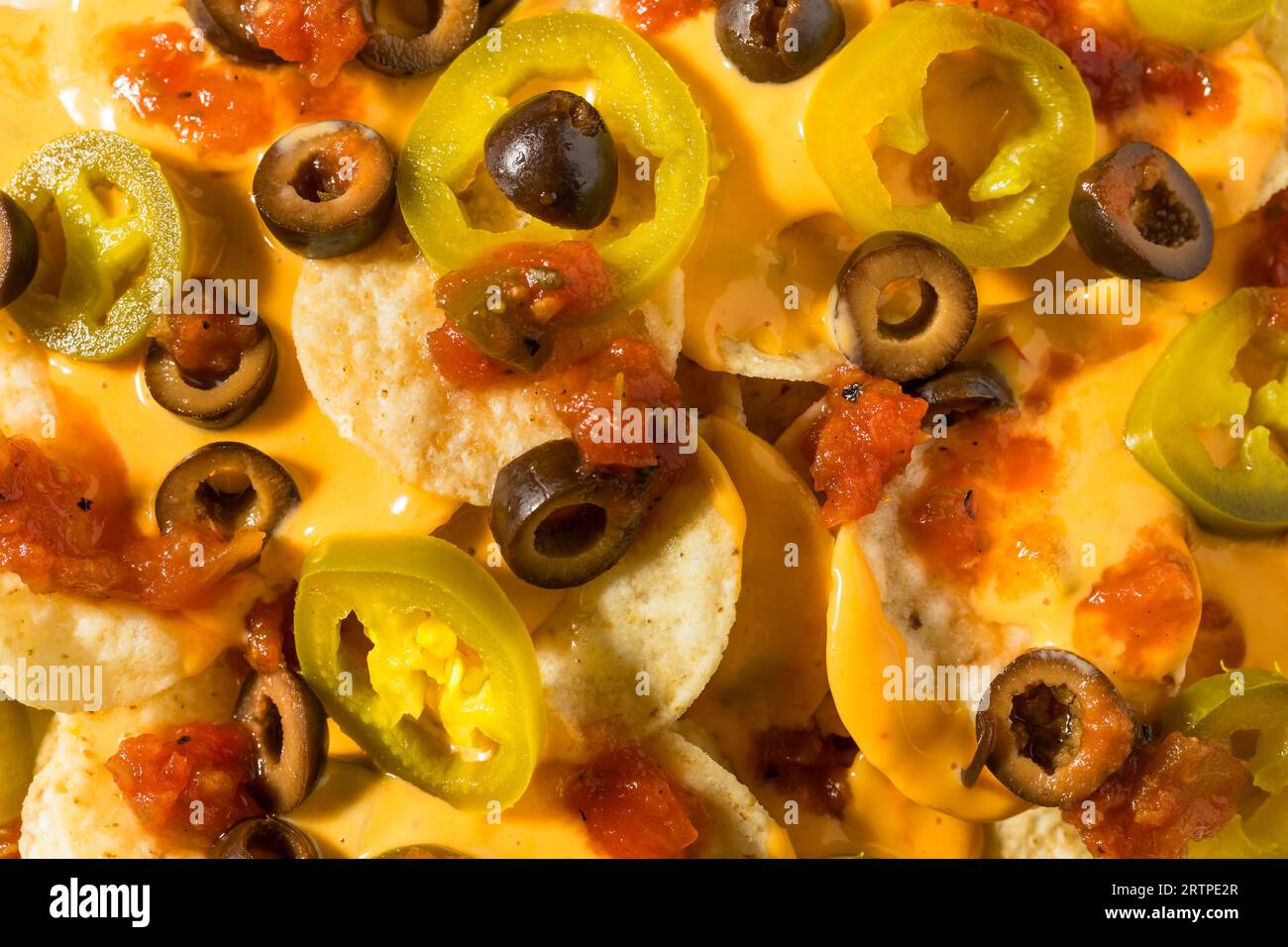 Homemade Basic Mexican Nachos with Cheese Jalapeno and Olives Stock ...
