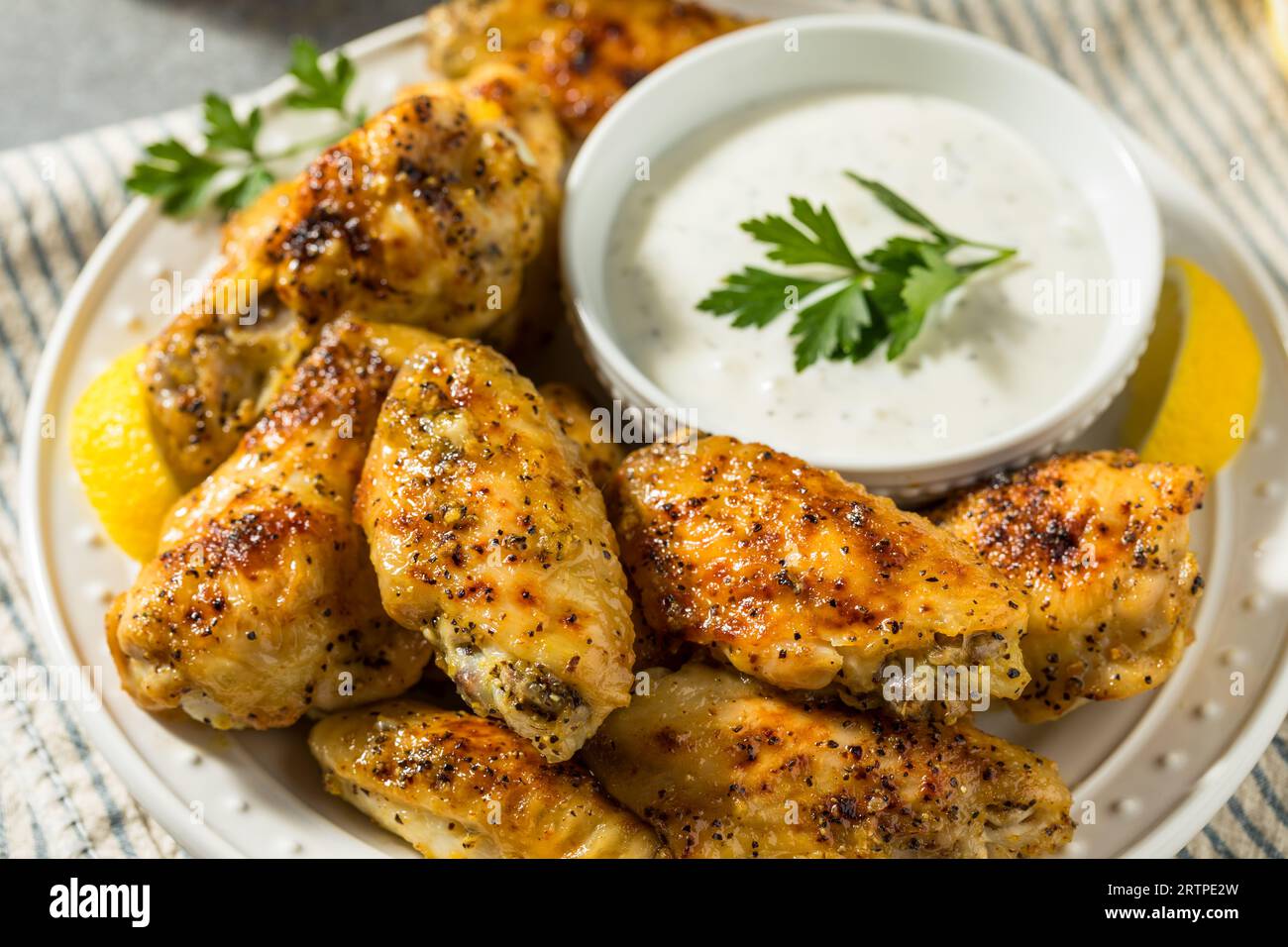 Homemade Spicy Lemon Pepper Chicken Wings with Ranch Dressing Stock ...