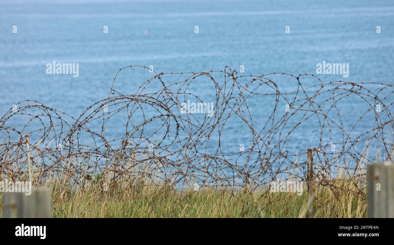 barbed wire in the border and sea in background without people Stock ...