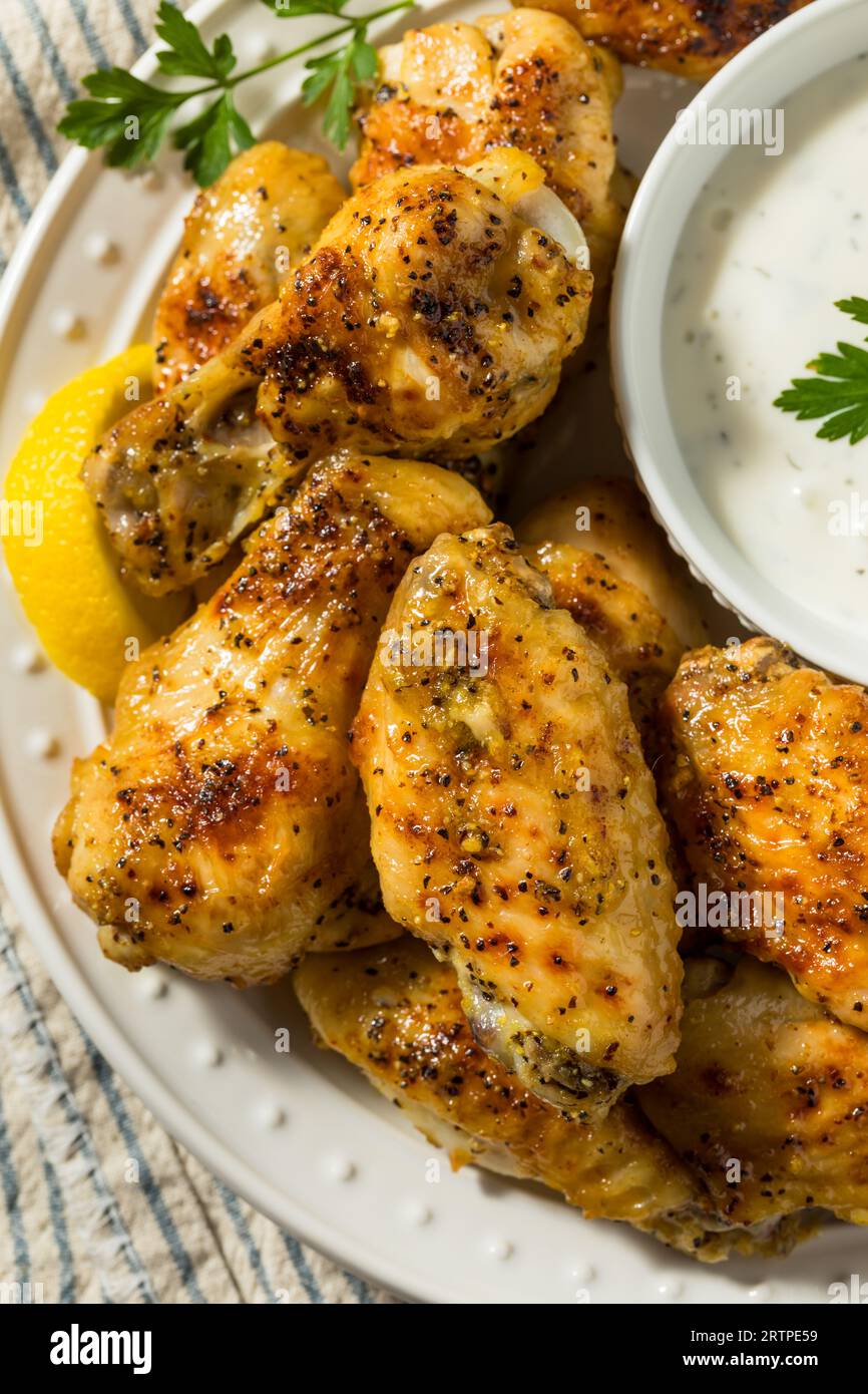 Homemade Spicy Lemon Pepper Chicken Wings with Ranch Dressing Stock ...