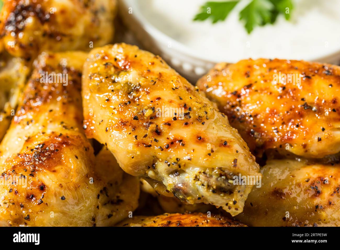 Homemade Spicy Lemon Pepper Chicken Wings with Ranch Dressing Stock ...