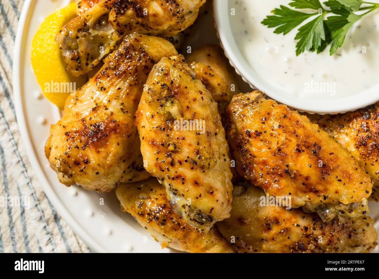 Homemade Spicy Lemon Pepper Chicken Wings with Ranch Dressing Stock ...