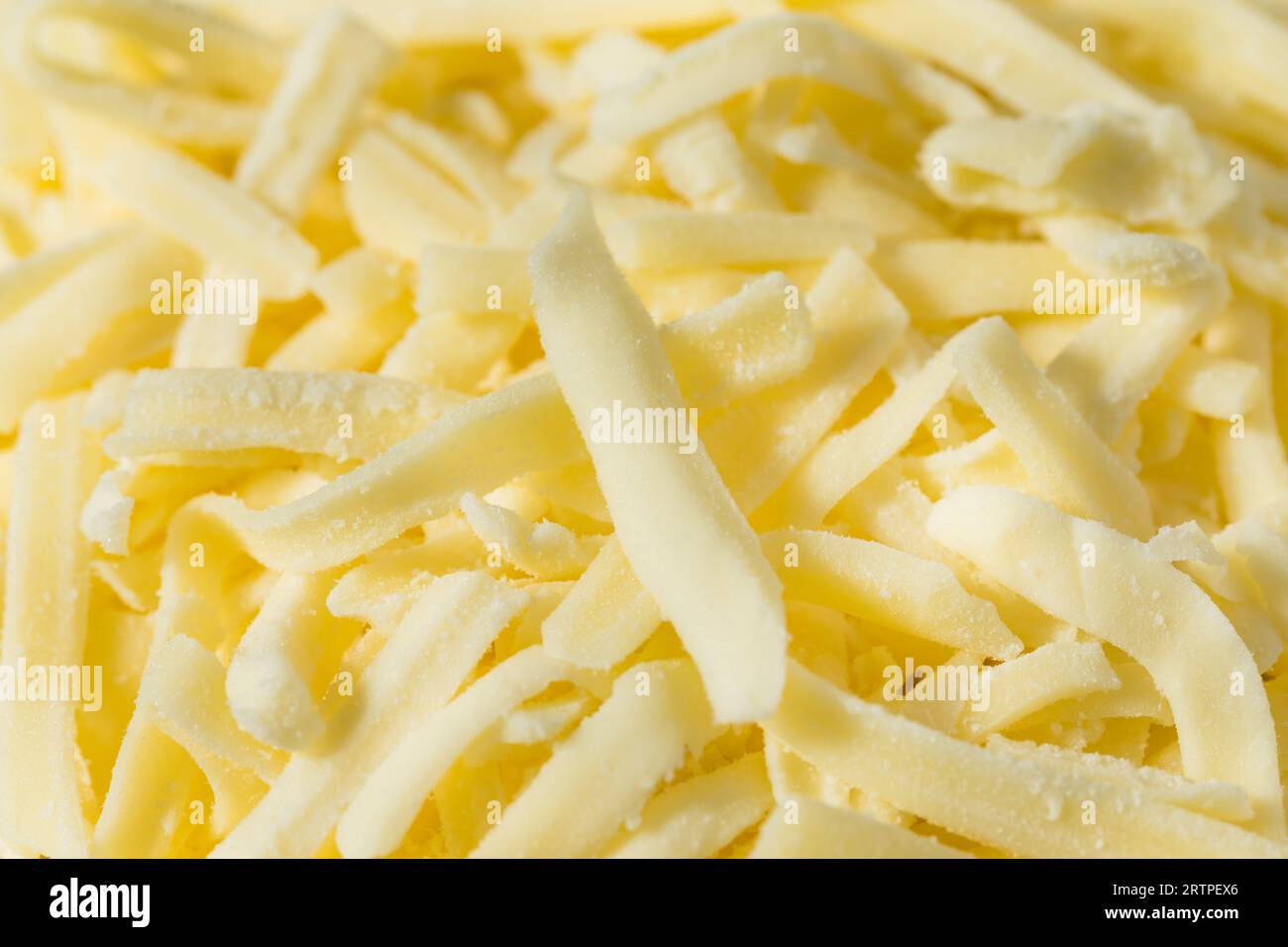 Shredded mozzarella cheese hi-res stock photography and images - Alamy