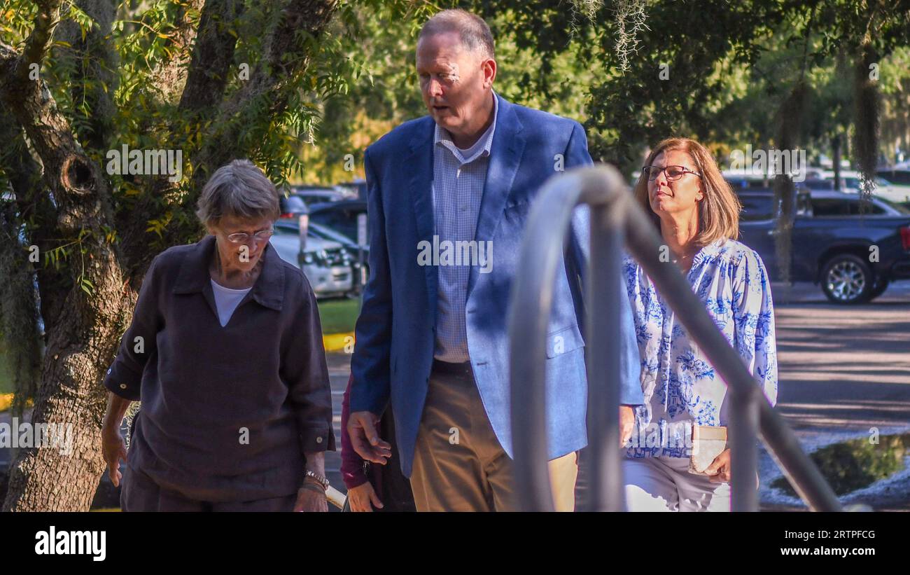 Former Hampton bank CEO Russell Laffitte, center, and his family walk ...