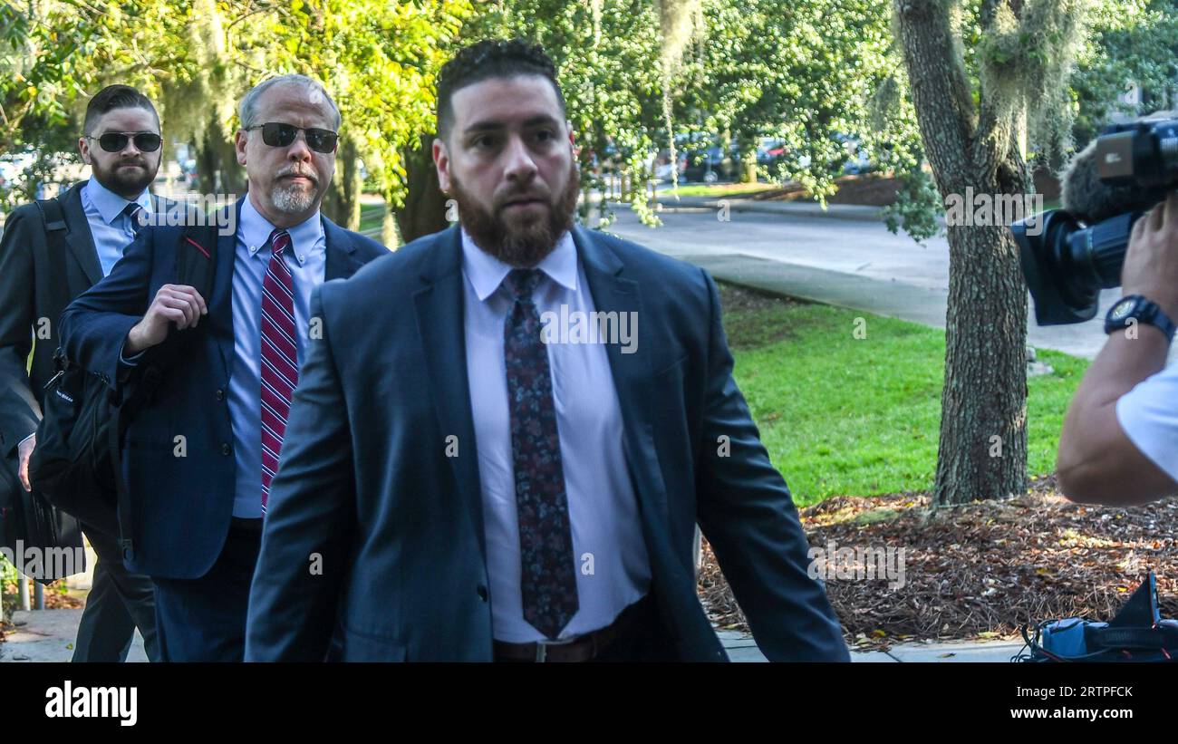 State prosecutor Creighton Waters, second from left, and his team walk ...