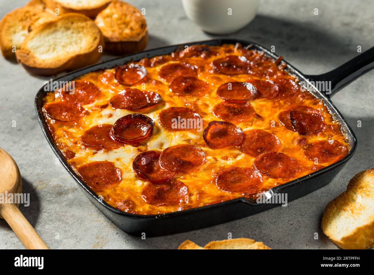 Homemade Pepperoni Pizza Appetizer Dip with Toasted Bread Stock Photo ...