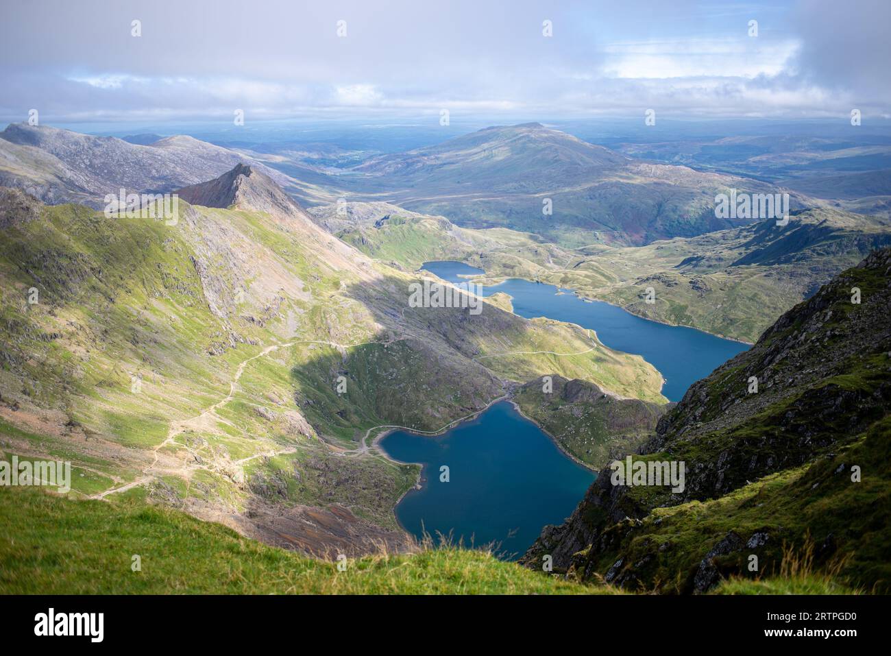 The view looking down at the landscape and lakes from the top of ...