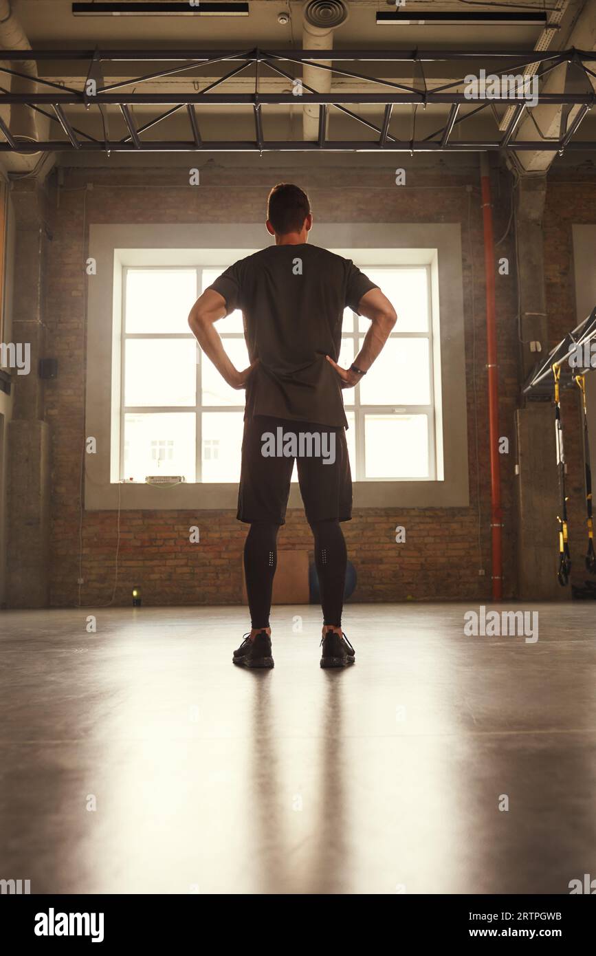Sport is my lifestyle. Back view of young athletic man in sportswear ...