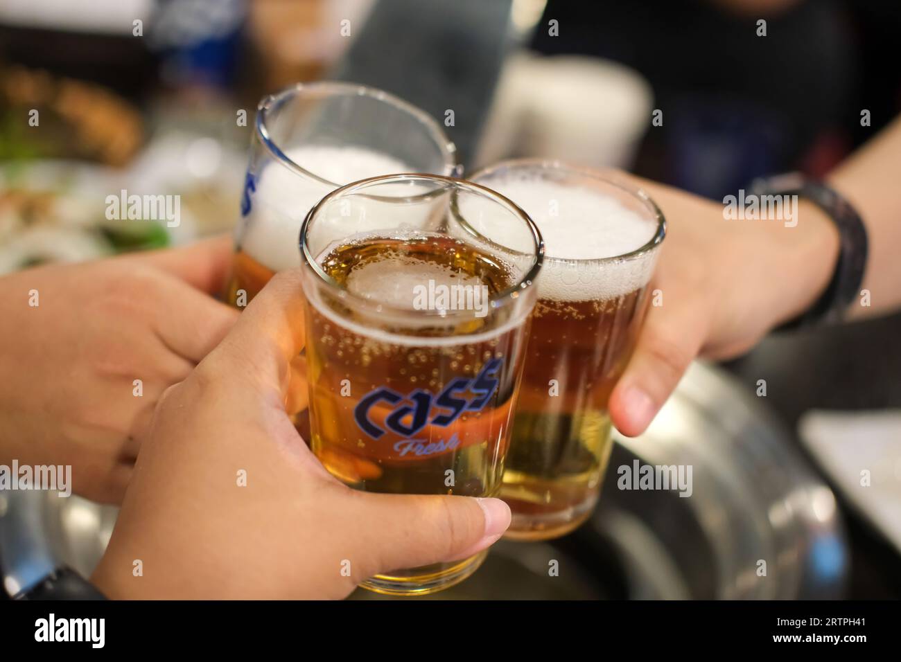 Seoul, South Korea - 4 April 2023: Group of people toasting glass of ...