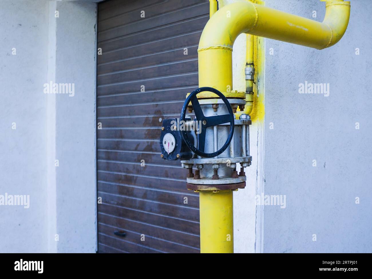 yellow valve on the gas pipe. Providing with natural gas population ...