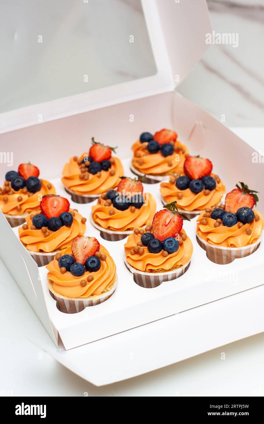 Box cake with orange frosting hi-res stock photography and images - Alamy