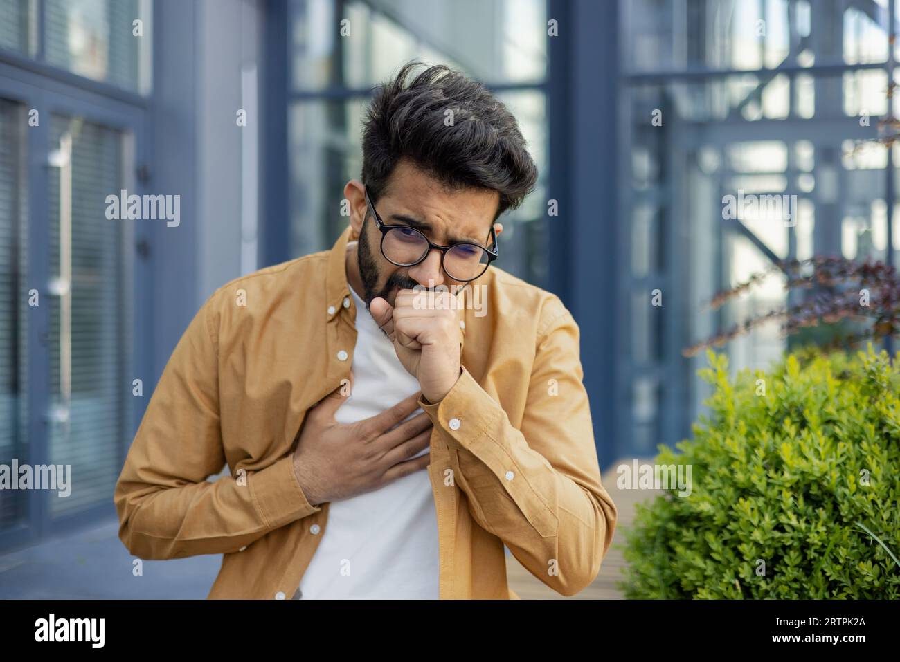 Sick young man coughing standing hi-res stock photography and images ...