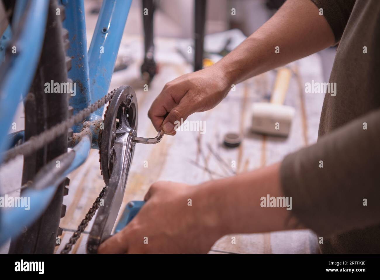 unrecognizable man tightening a crank of a bmx, sideview Stock Photo ...