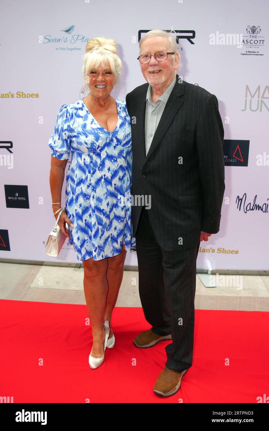 Billy Butler and wife attending the Liverpool premiere of Bolan's Shoes ...