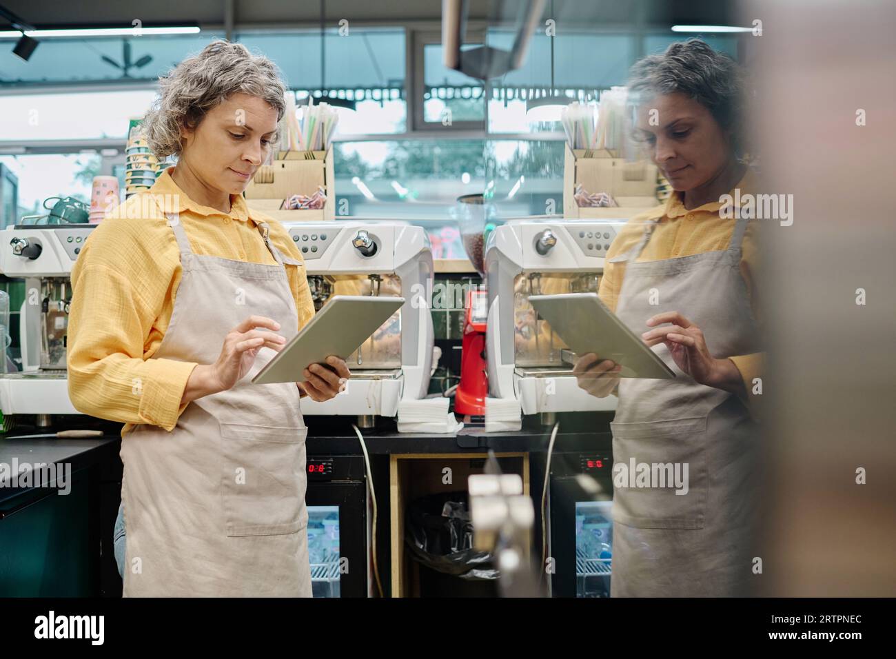 Manager supermarket in apron hi-res stock photography and images - Alamy