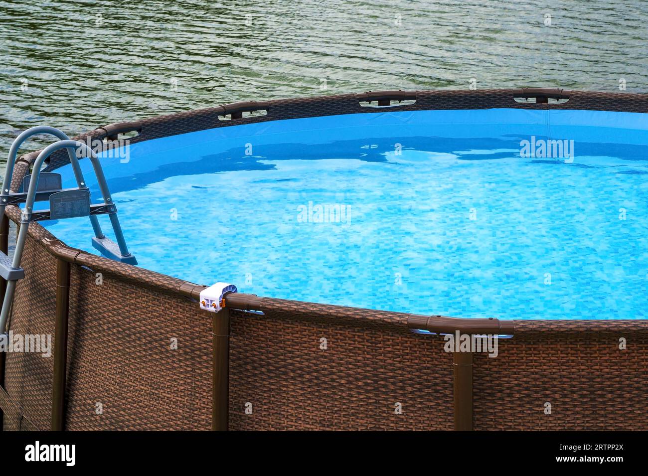 The Frame pool with blue water outdoor. Near the river the Frame pool ...