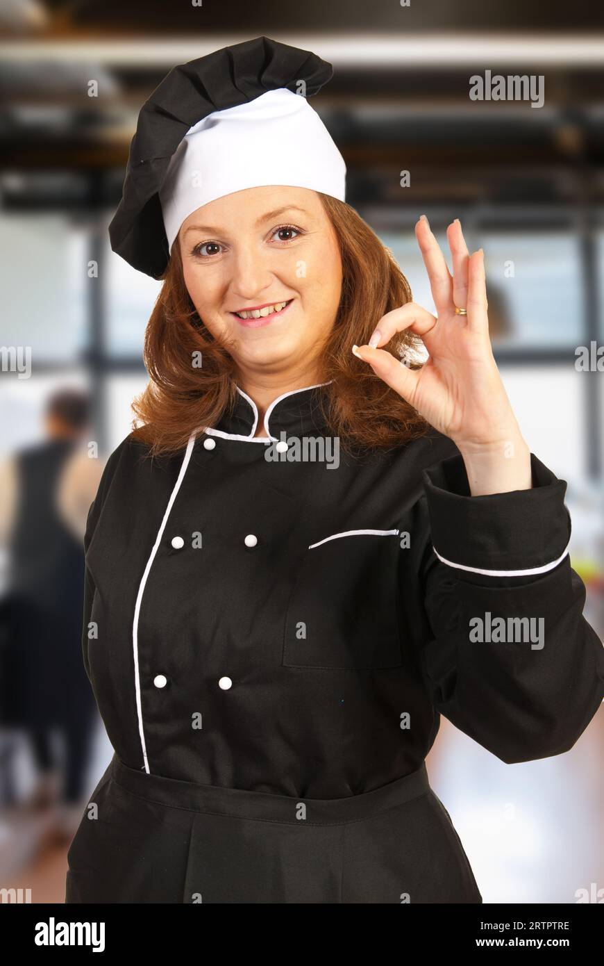 Happy chef woman showing okay isolated on white background Stock Photo ...