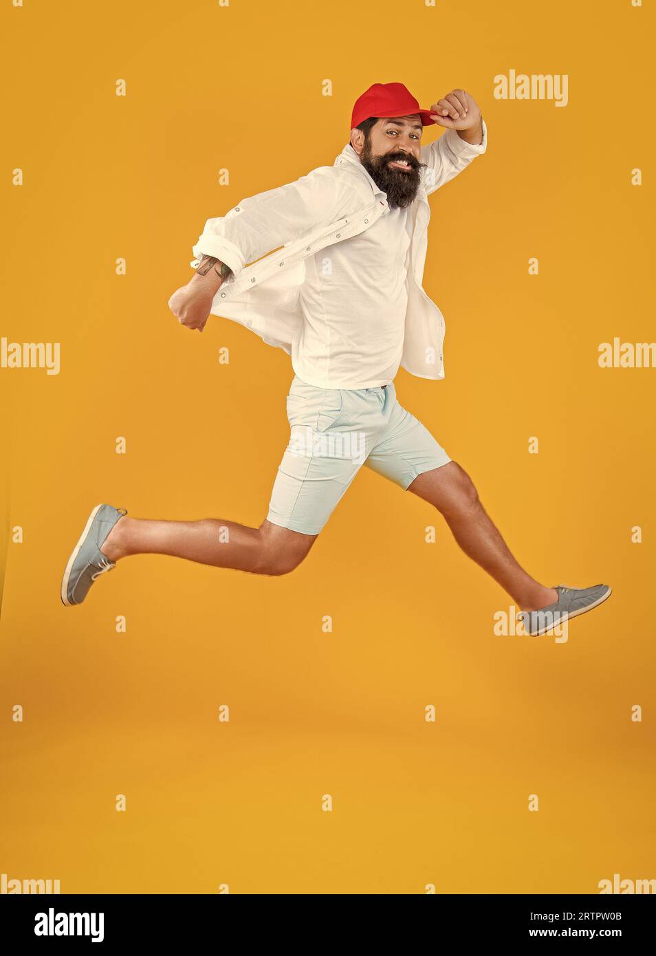 positive bearded guy hurry on background. photo of bearded guy in a ...