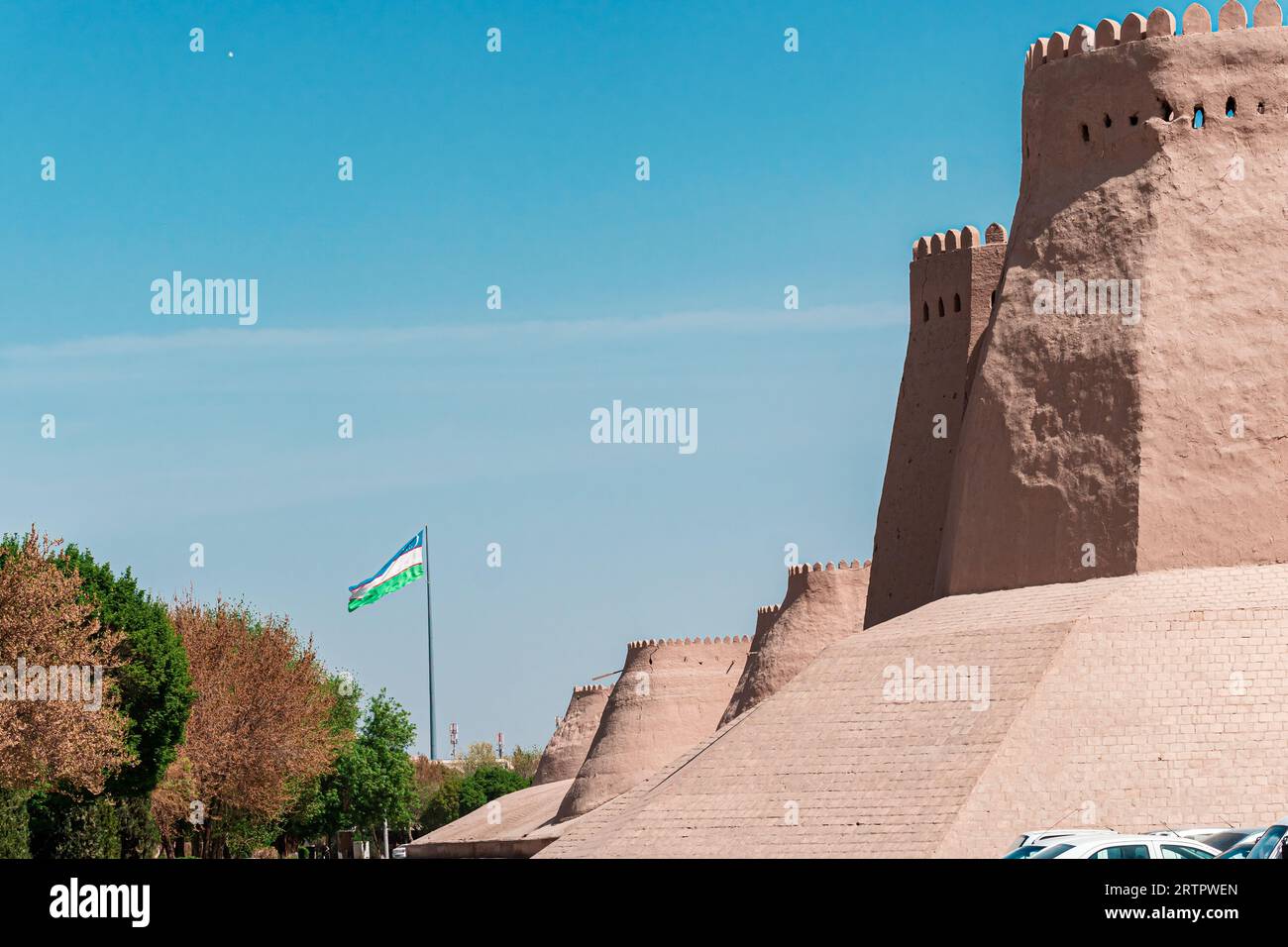 Uzbekistan waving flag near old city Khiva ancient walls Stock Photo ...