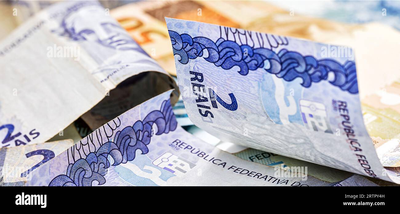 various Brazilian money notes, dirty and fallen on the floor ...