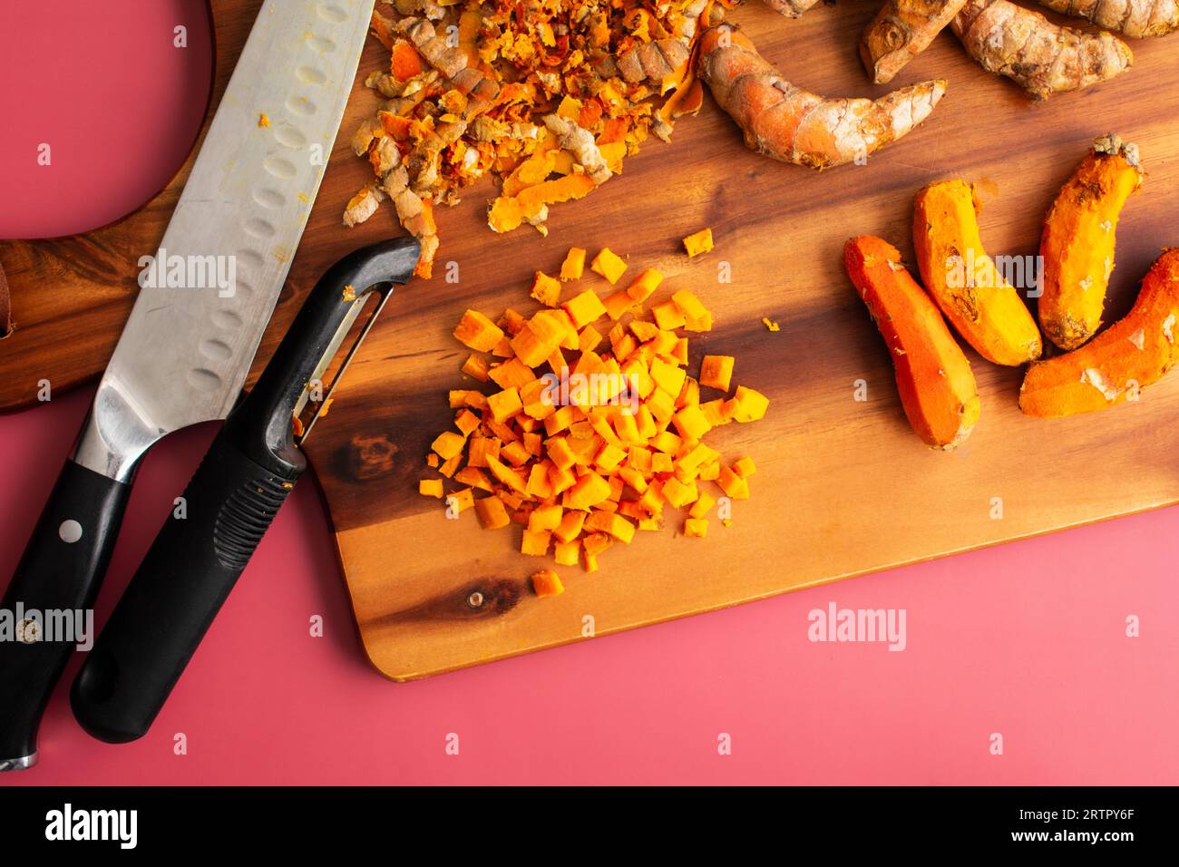 Diced, Whole, and Peeled Turmeric on a Wooden Cutting Board: Turmeric ...