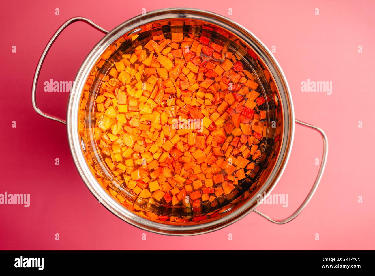 Diced Turmeric in a Small Pot with Liquid: Peeled and chopped fresh ...