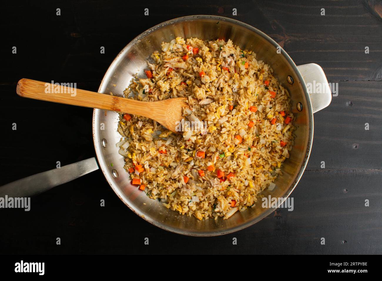 Thai Style Crab Fried Rice in a Large Skillet with a Bamboo Spatula: A ...