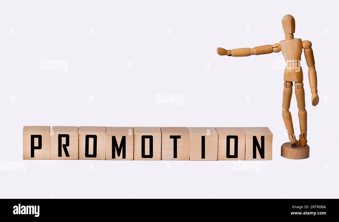 Promotion word made from wooden blocks on white background with wooden ...