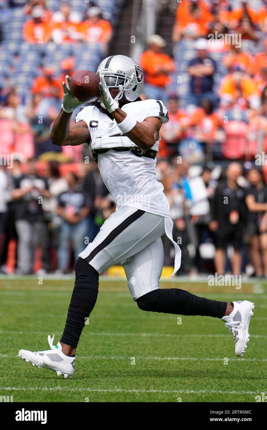 Las Vegas Raiders wide receiver Davante Adams warms up against the Denver Broncos during an NFL ...