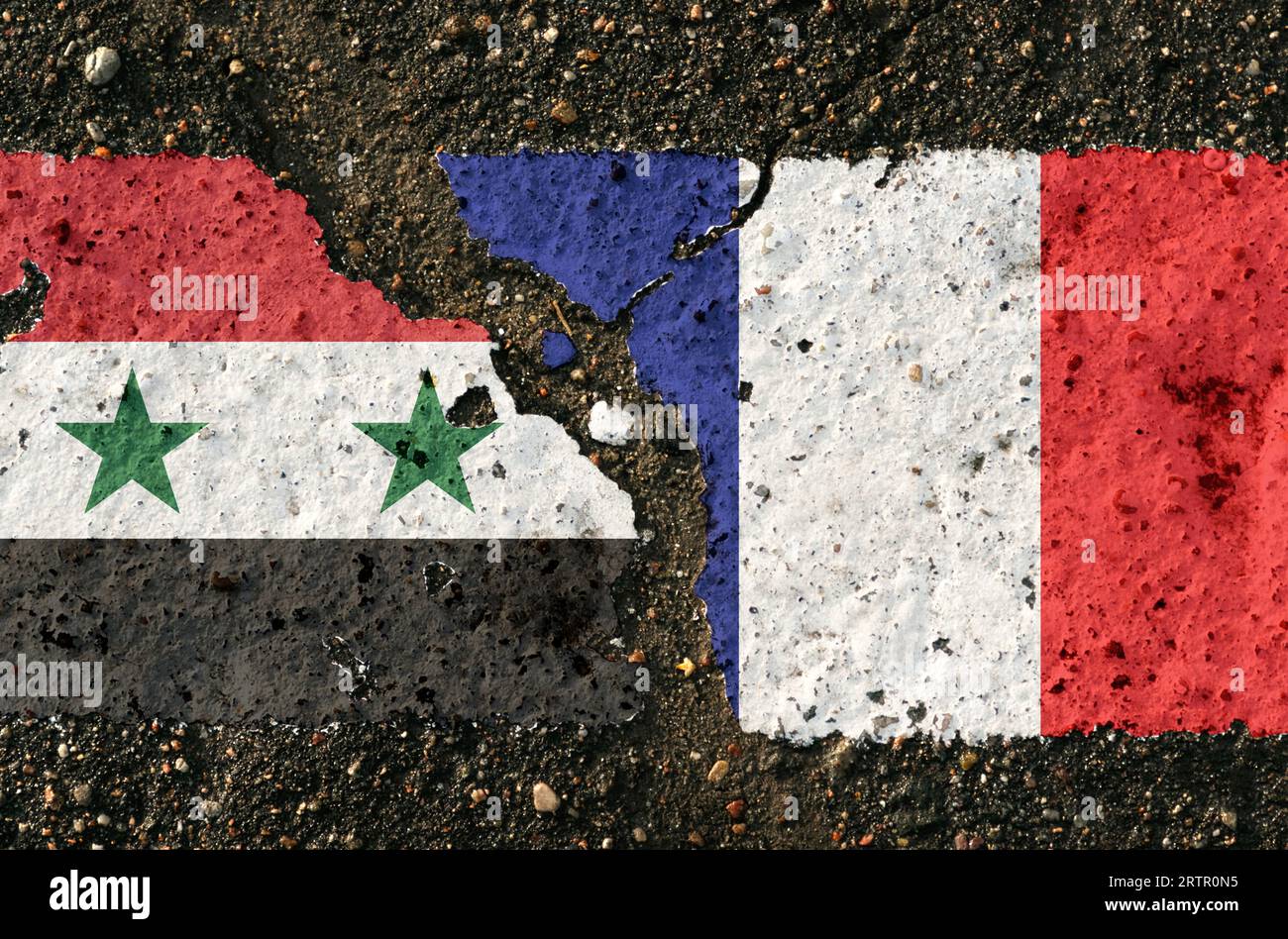On the pavement are images of the flags of Syria and France, as a ...