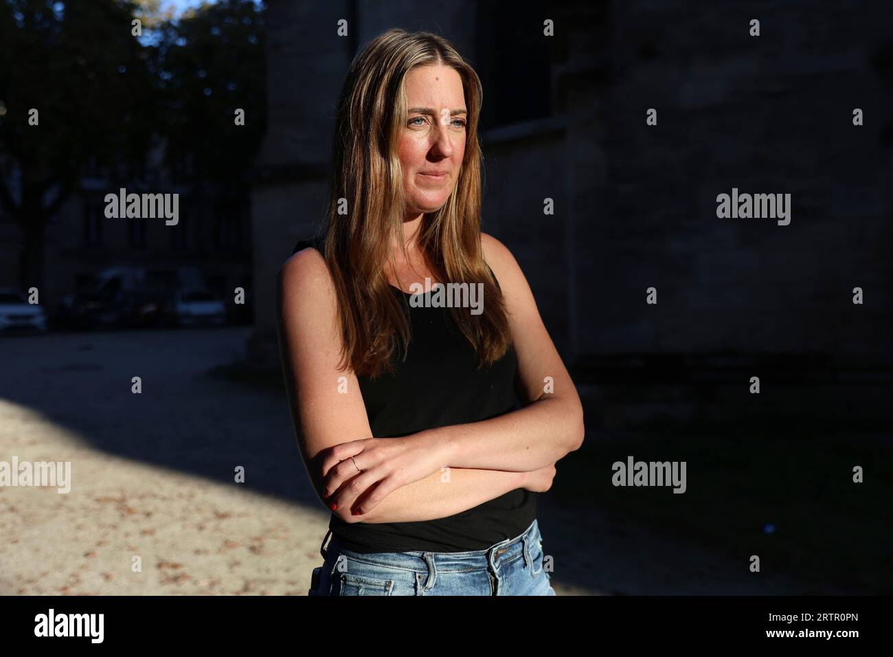 Kristy Benner, from Los Angeles, USA, poses outside the Saint-Andre ...