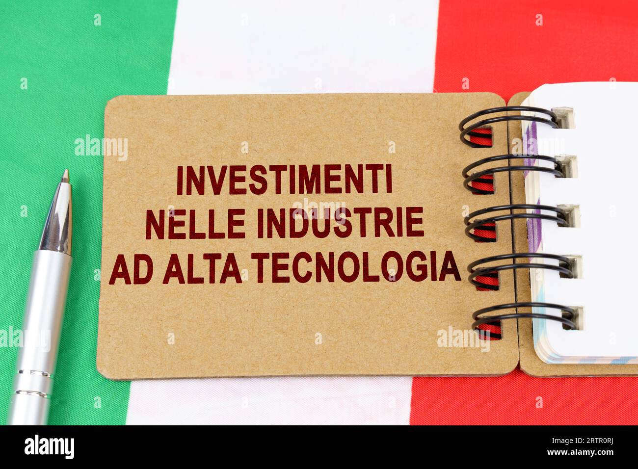 Economy and finance concept. On the flag of Italy lies a pen and a ...