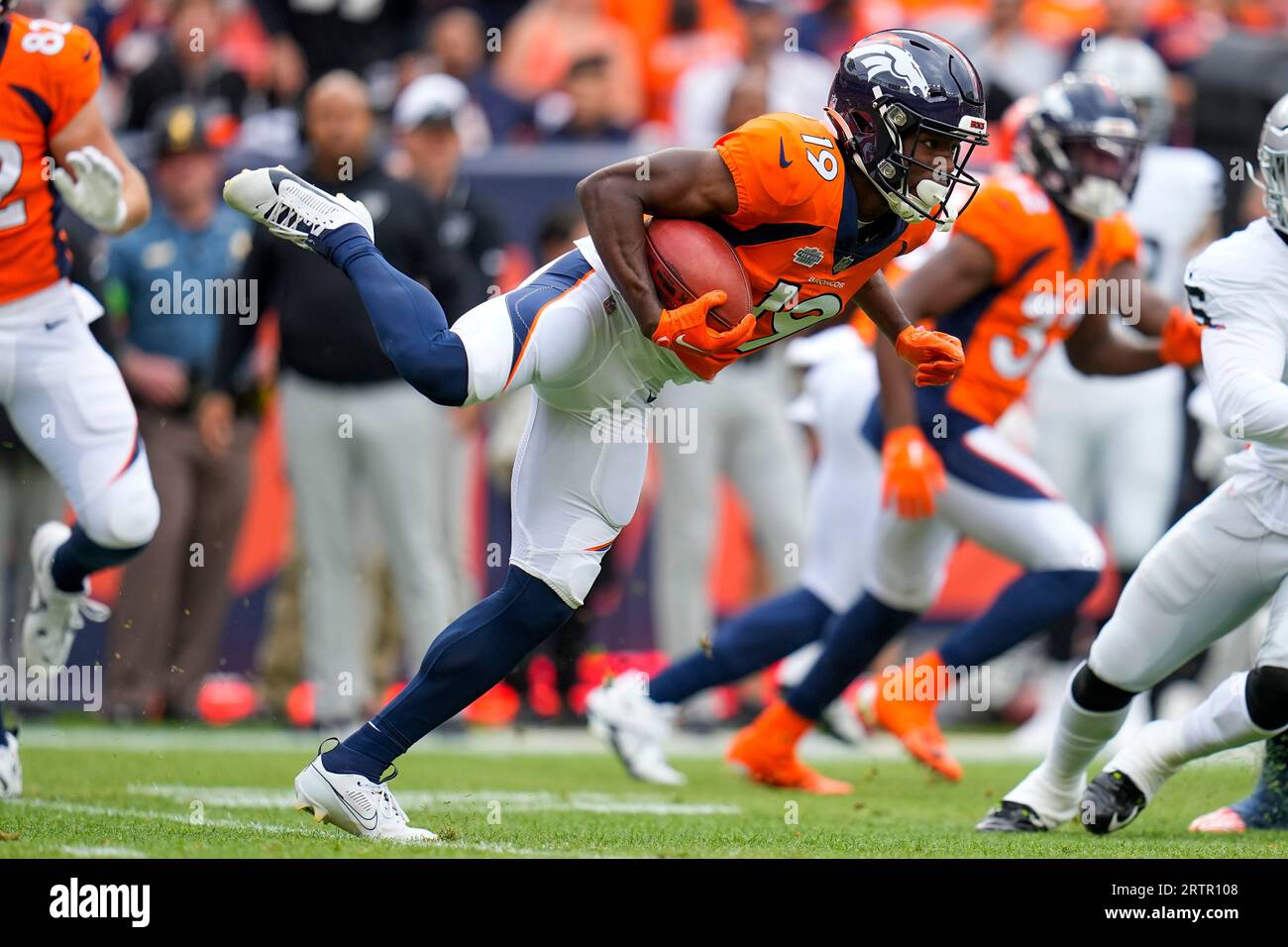 Denver Broncos receiver Marvin Mims Jr. (19) returns a punt against the ...