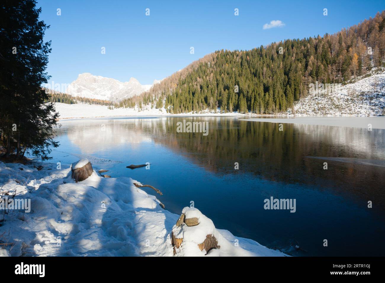 Alpine lake with dolomites in background, Calaita lake in winter season ...