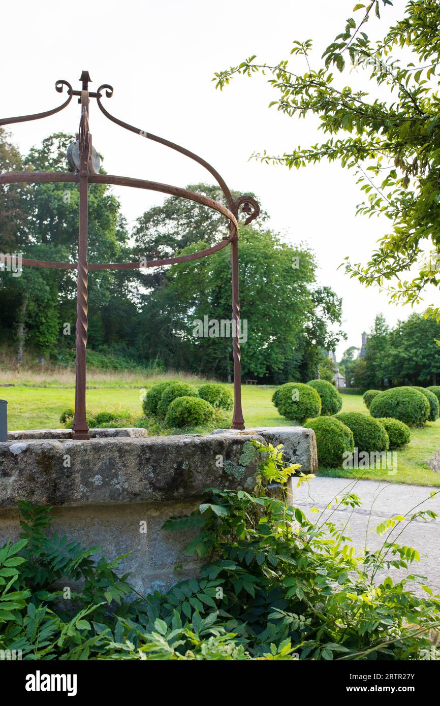 The well of Beauport Abbey gardens, a roofless gothic building located ...